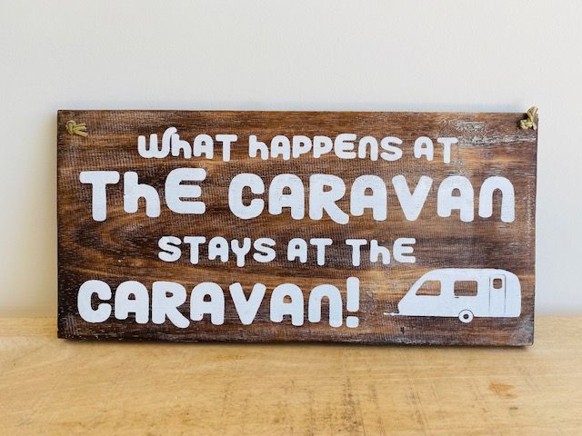 WHAT HAPPENS AT CARAVAN SIGN - That Beach Shop